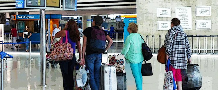 With suitcases in hand, Cypriots grab the packages for the three days ...